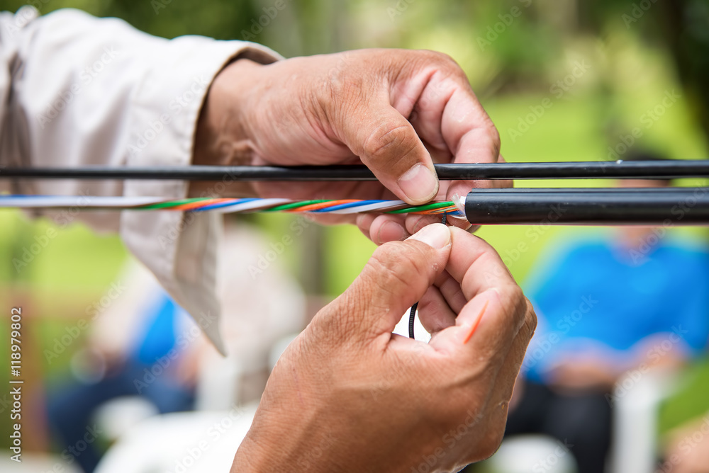 Technicians are installing optic fiber with cable ties. Stock Photo ...