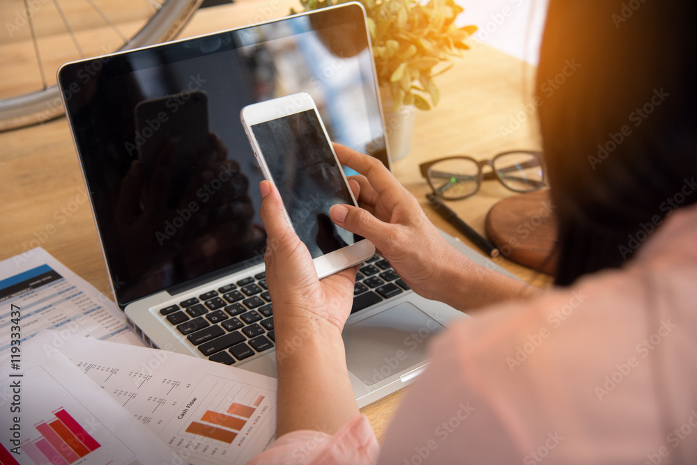 Beautiful business working woman using Iphone Ipad while working with ...