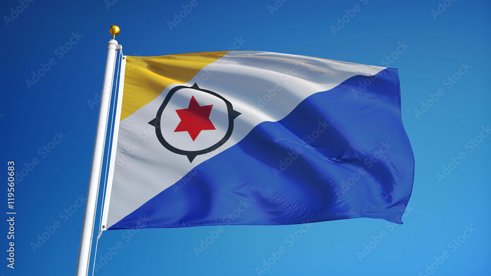 Bonaire flag waving against clean blue sky, close up, isolated with ...