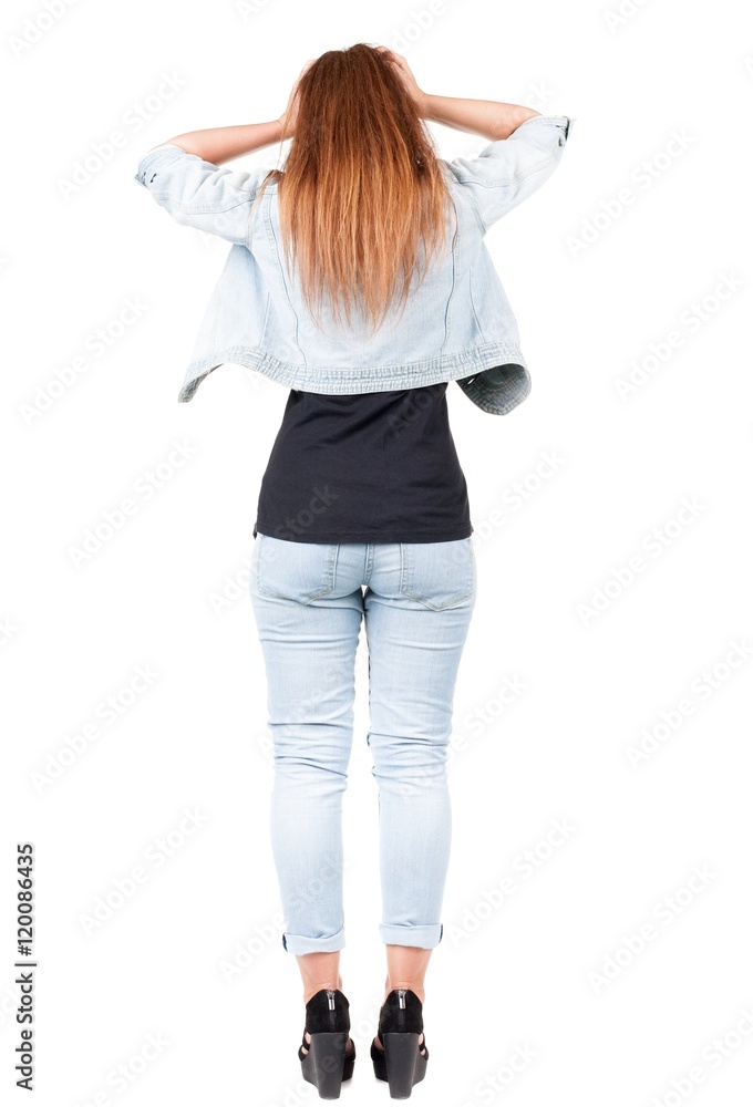 Back view of shocked redhead woman in jeans. upset young girl. Rear ...