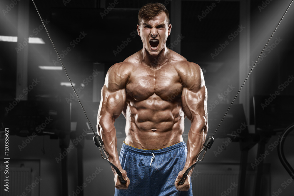 Muscular man working out in gym doing exercises, strong male naked torso abs Stock Photo | Adobe ...