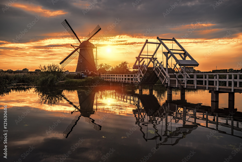 Beautiful sunset over the Unesco world heritage windmill at the other ...