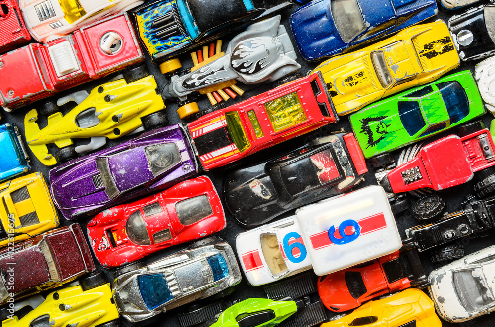 Foto de Stock top view of multi-colored toy cars | Adobe Stock