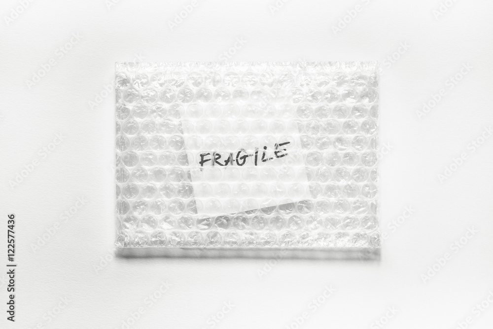 fragile, handwriting on white squre paper in bubble pack, white paper ...