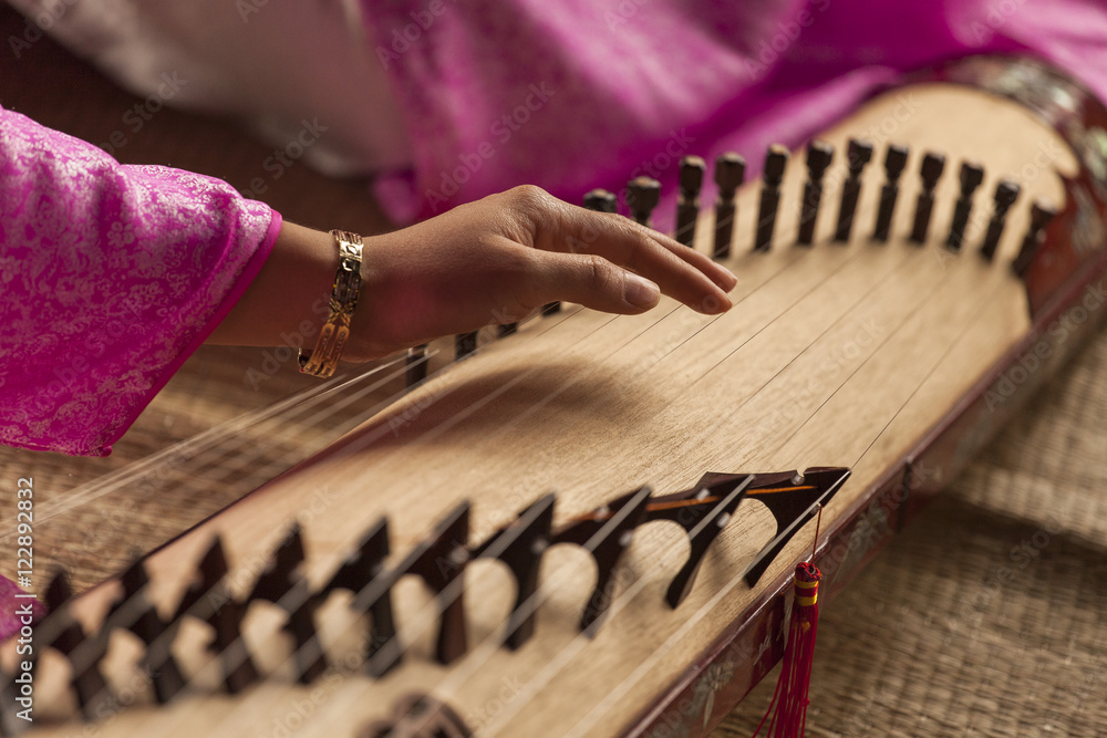 Woman play a traditional korean twelve string instrument : the gayageum ...