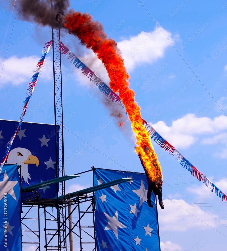 Fire Diver Daredevil Performing a high dive off platform head first ...