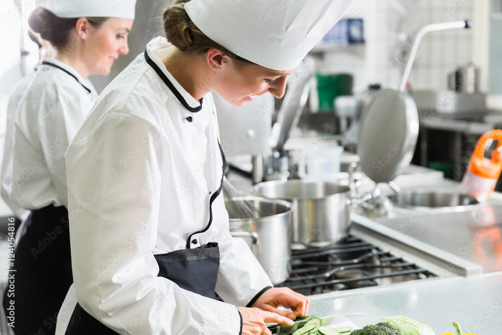 Female chefs at work in system catering Stock Photo | Adobe Stock