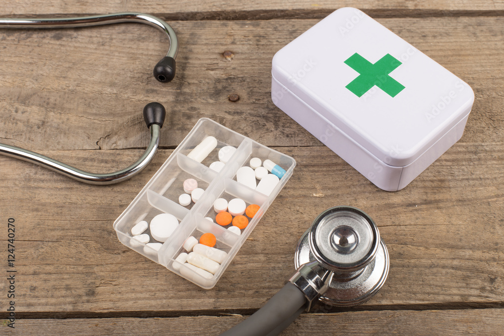 Foto de Stock Workplace of a doctor. Stethoscope,emergency kit, and ...