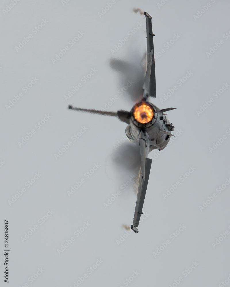 Fighter jet in a high g turn, with condensation trails forming at the ...