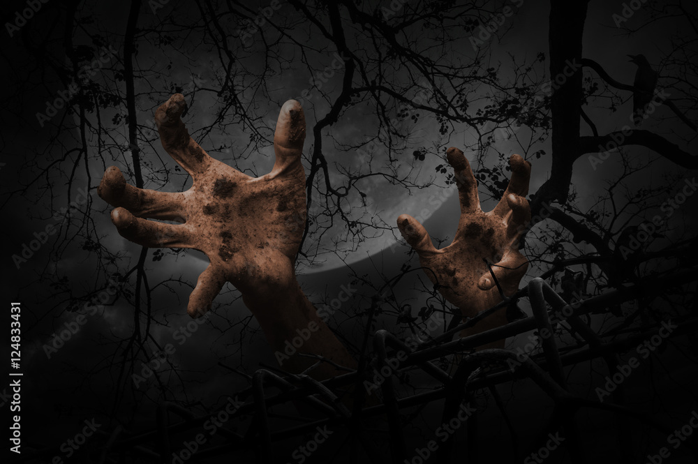 Zombie hand rising out from old fence over dead tree, crow, moon Stock ...