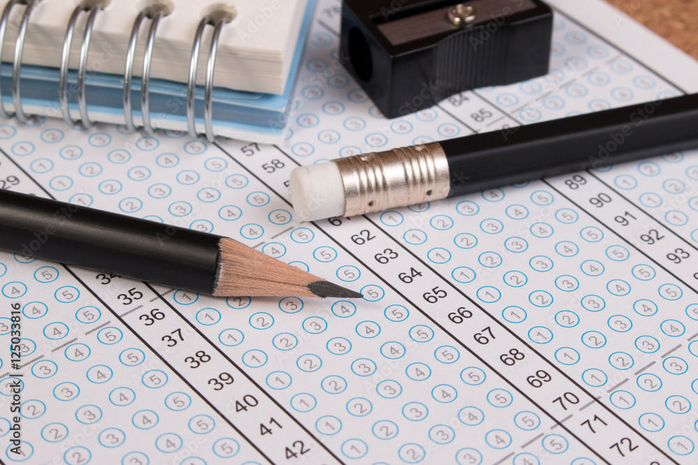 School exam answer sheet and pencil. Answer sheet focus on pencil ...