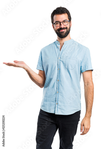Handsome man holding something Photo Stock | Adobe Stock