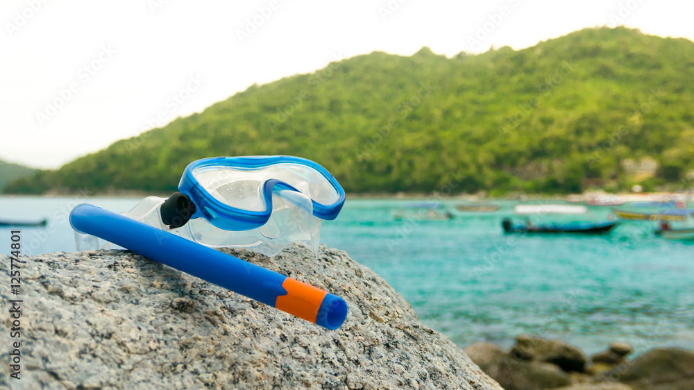 Snorkeling equipment: snorkel and diving google on the stone. Tr Stock ...