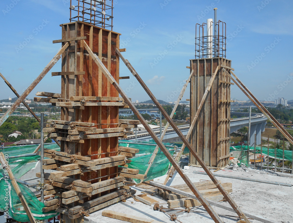 Column timber form work and reinforcement bar at the construction site ...