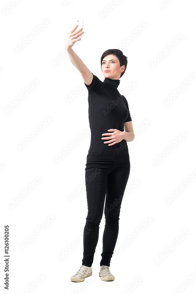 Gorgeous feminine elegant woman in black clothes taking selfie from ...