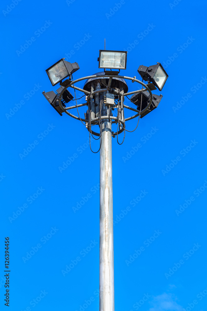 Spotlight and the sky. Large tall high outdoor stadium spotlights ...