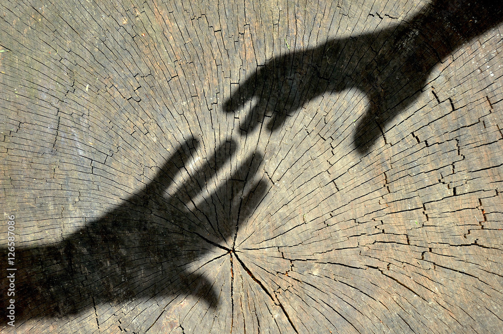 silhouette of helping hand concept. Original wallpaper with natural ...