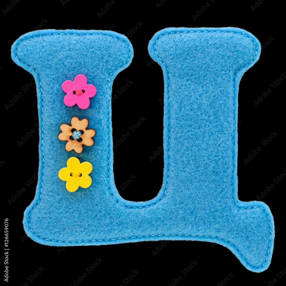 Letter of the alphabet made of blue felt isolated on black background ...