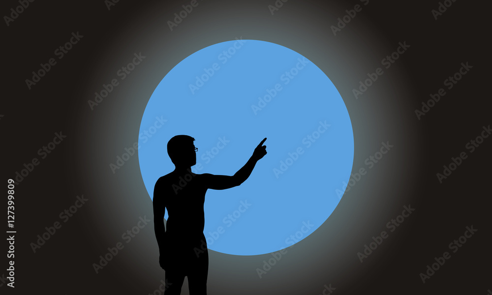 Silhouette man with hand pointing on super blue full moon background ...
