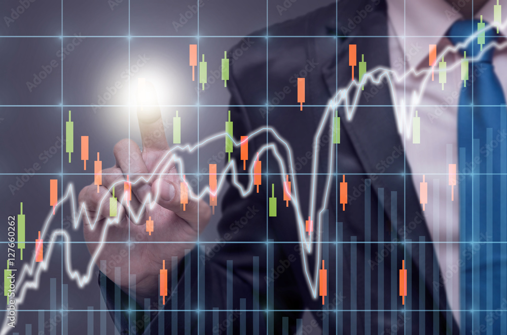 Businessman pointing or touching the trading graph of stock mark Stock ...