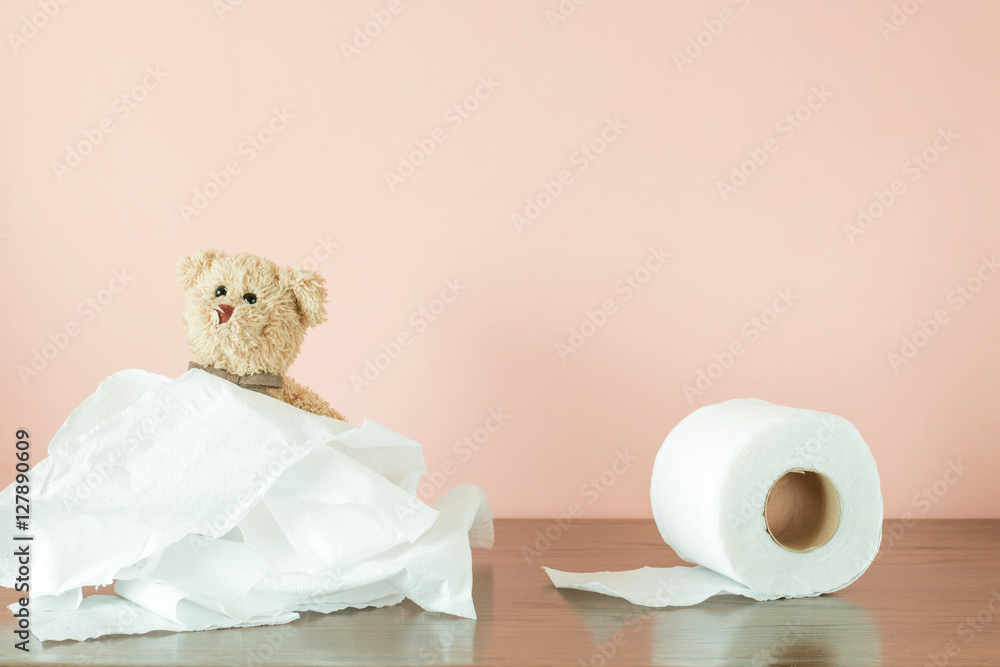 teddy bear playing tissue paper roll Stock Photo | Adobe Stock