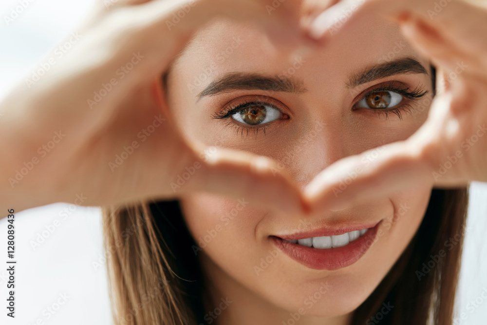 Beautiful Happy Woman Showing Love Sign Near Eyes. Stock Photo | Adobe ...