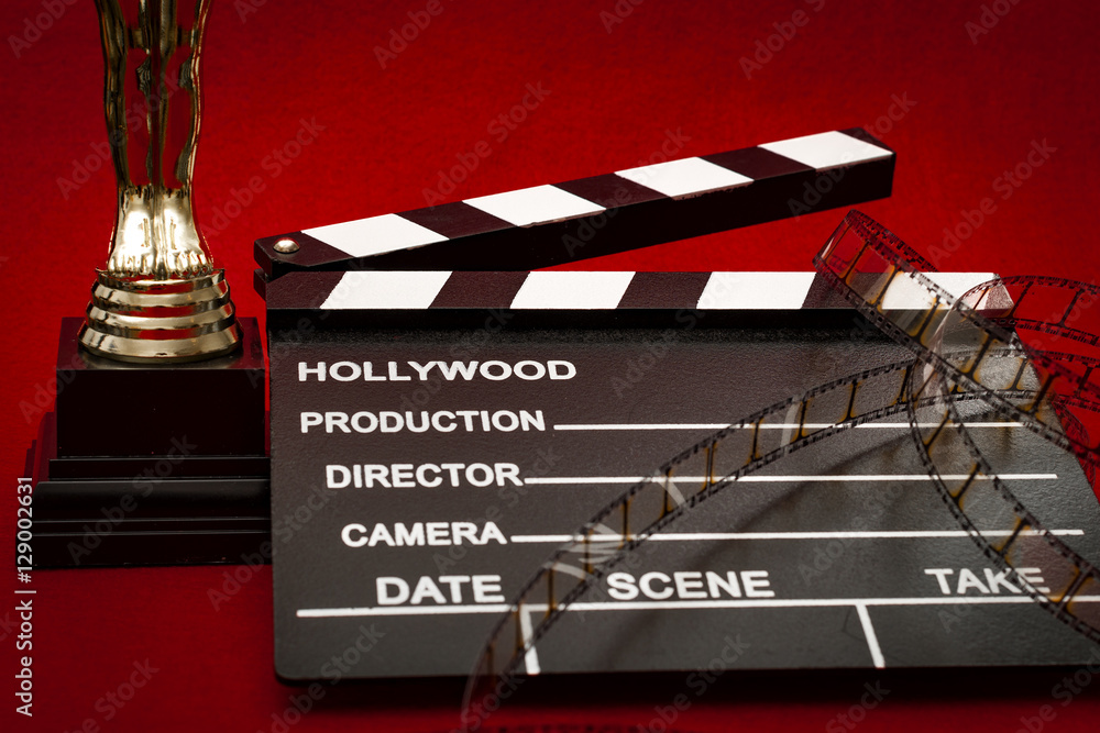 Hollywood film awards concept with shiny metallic movie award wrapped ...