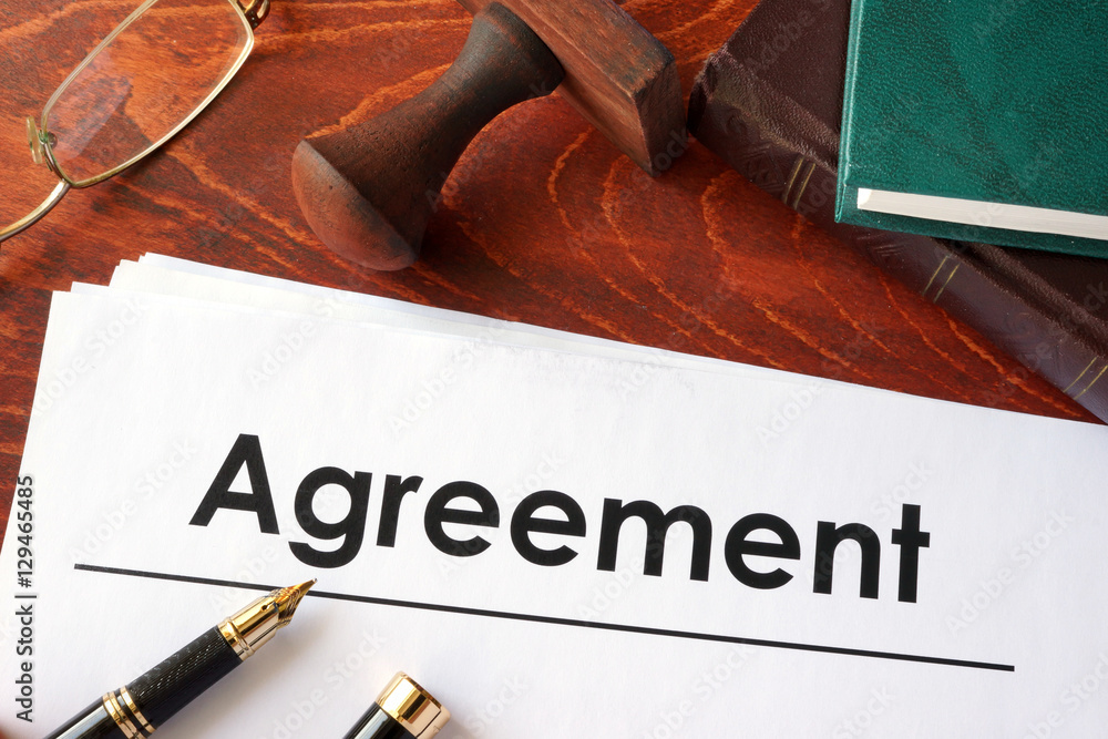 Agreement form on an office table. Stock Photo | Adobe Stock