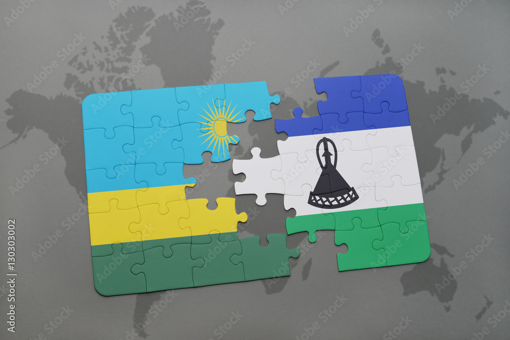 puzzle with the national flag of rwanda and lesotho on a world map ...