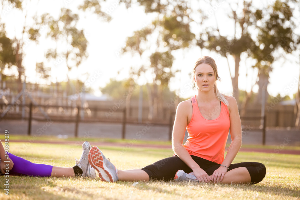 Beautiful female fitness model stretching and training on athlet Stock ...