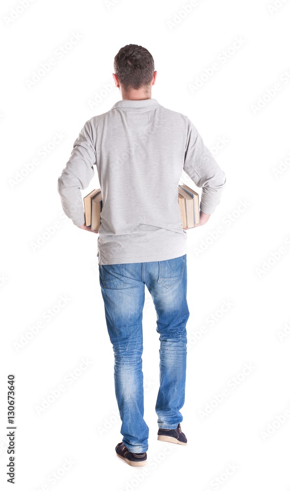 man goes and has a stack of books. back view. Rear view people ...
