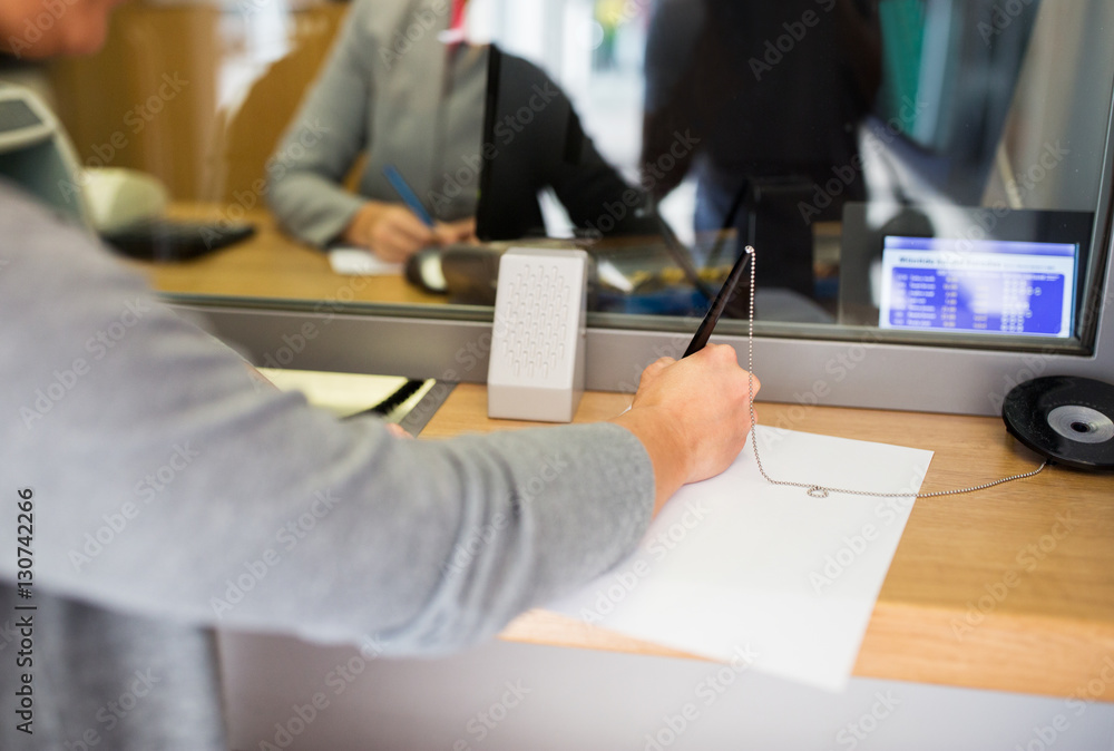 customer writing application at bank office Stock Photo | Adobe Stock