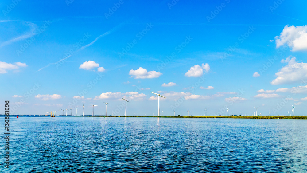 Wind Farm with Two and Three bladed Wind Turbines along the Shore of ...