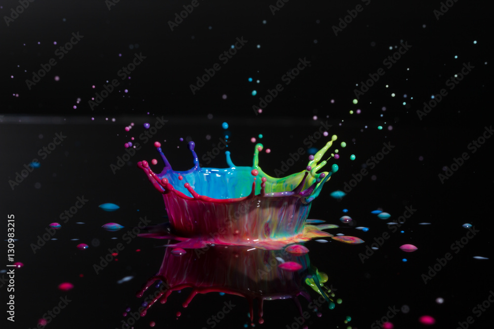 Paint drop captured as it collides with a surface producing an artistic ...