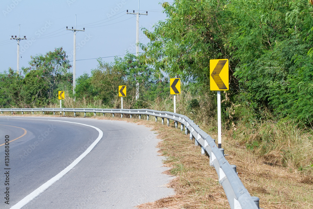 Yellow road signs warn Drivers for Ahead Dangerous Curve Stock Photo ...