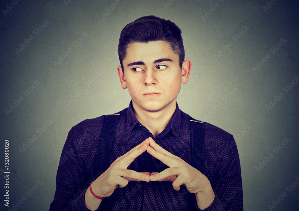 Sneaky scheming offended young man plotting something Stock Photo ...