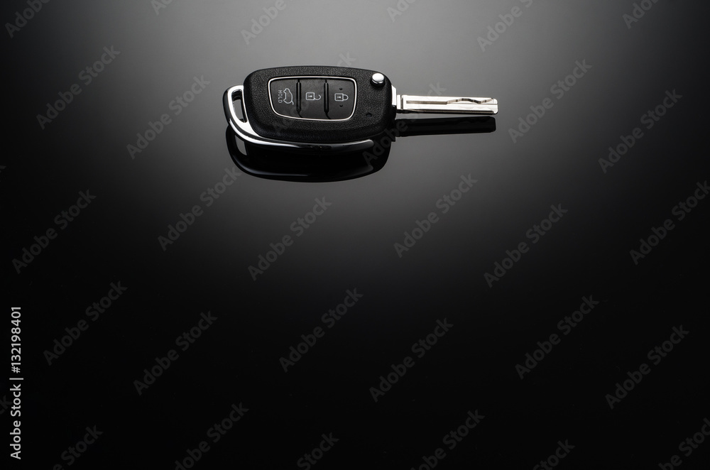 Modern car keys isolated on black reflective background with copy space ...