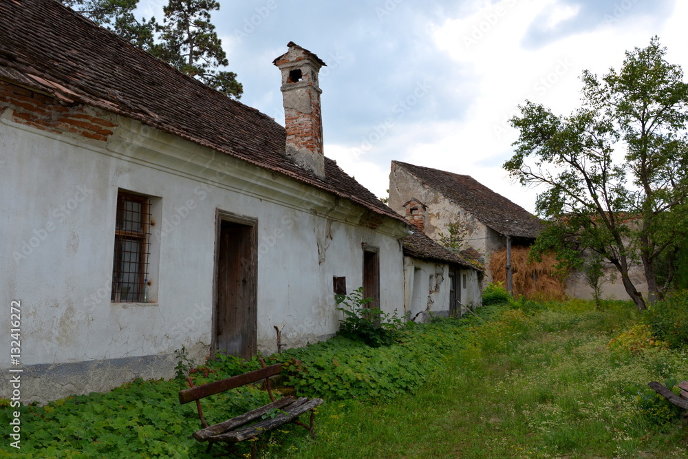 Courtyard of the fortified church.Ungra is a commune in Braşov County ...