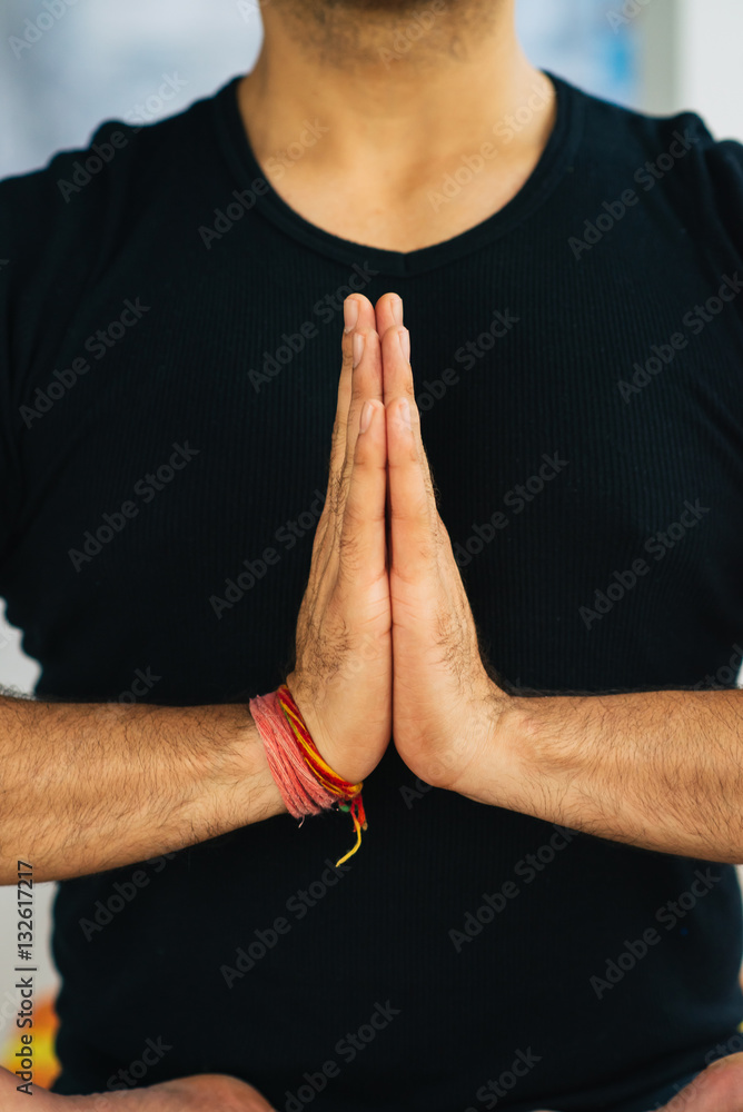 Hands in Namaste prayer mudra by Indian man practicing yoga Stock Photo ...