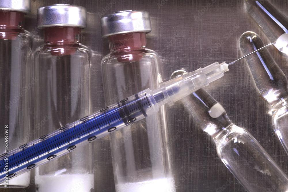 Pen medical syringe, three ampules with saline and vials with dry human ...