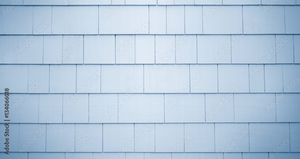 Neutral blue or gray siding on a house or building. Straight parallel ...