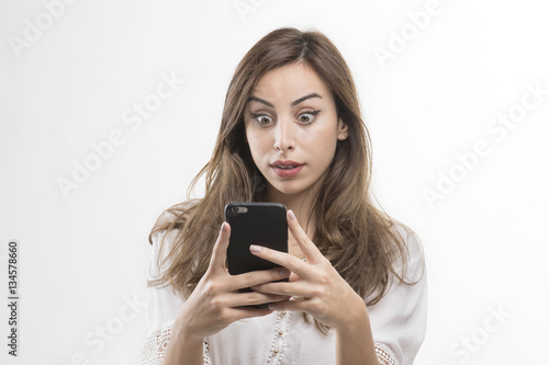 Shocked Woman Looking At Phone Young Girl Shocked Looking At Mobile