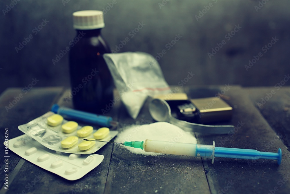 Hard drugs on dark table. A dark theme, drug use. Stock Photo | Adobe Stock