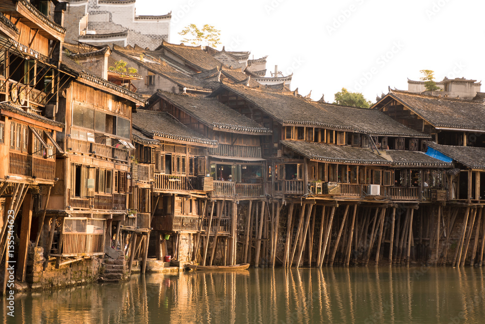 Photo of Historic Asian Village. Wooden Houses Above the Water ...