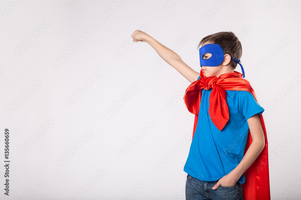 Little superman boy raised his hand up Stock Photo | Adobe Stock