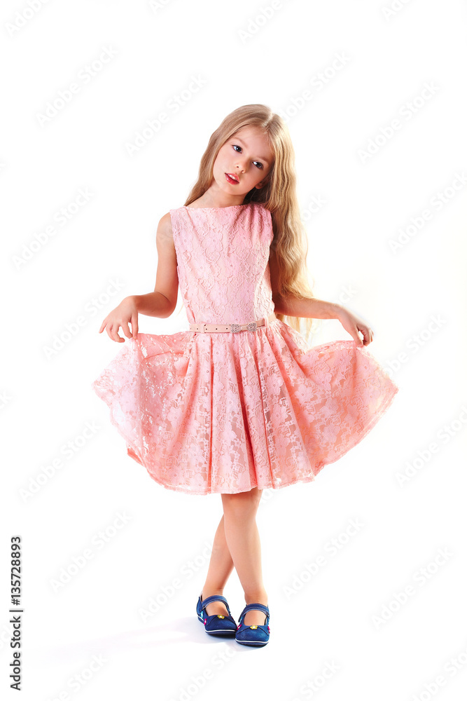 Pretty small blonde girl in pink prom dress dancing Stock Photo | Adobe ...