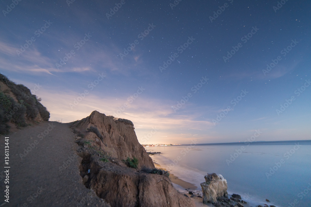 Starry night as sunsets at El Matador State beach near Malibu as light ...