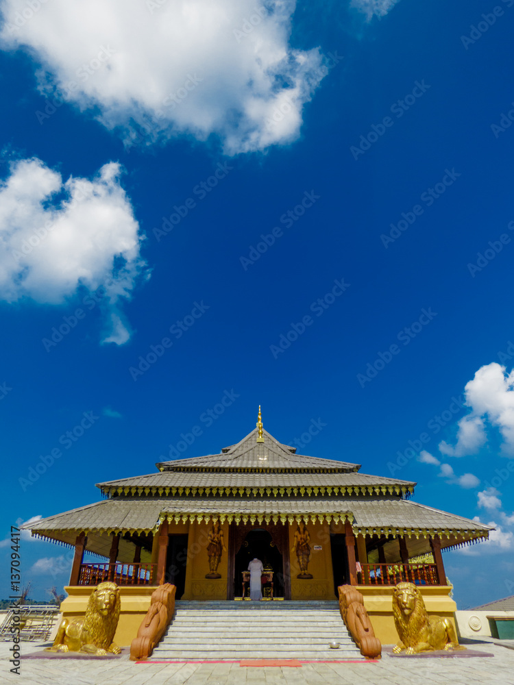 Golden Temple Palace Relic House with lion statue scluptures with blue ...
