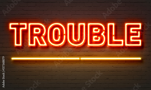 Trouble neon sign on brick wall background. Stock Illustration | Adobe ...