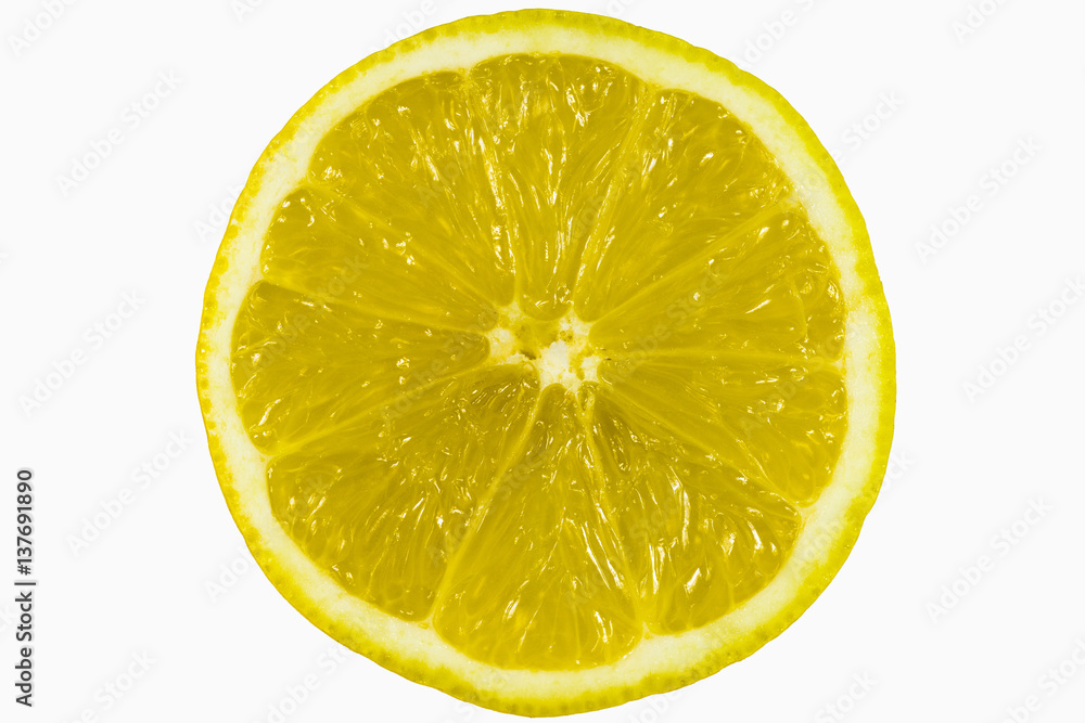 a cross-section of a half of a ripe yellow lemon exposed inside the ...